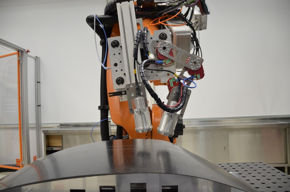 Air-coupled ultrasonic inspection of a skin element