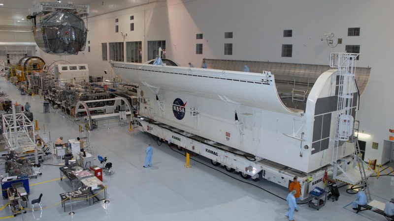 The Columbus Laboratory module moves across the facility to the waiting ...
