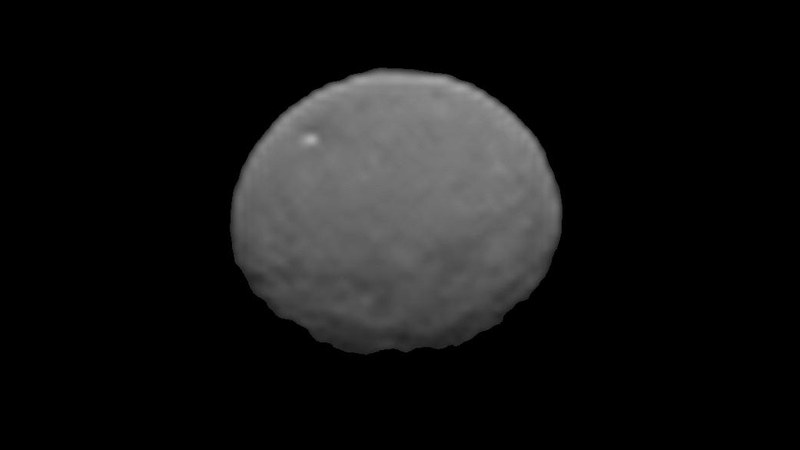 Ceres: craters, structures and a bright spot
