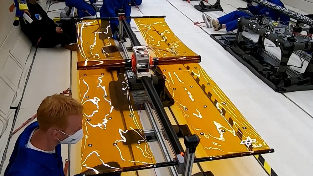 SpaceMast unfurls a solar panel during a parabolic flight